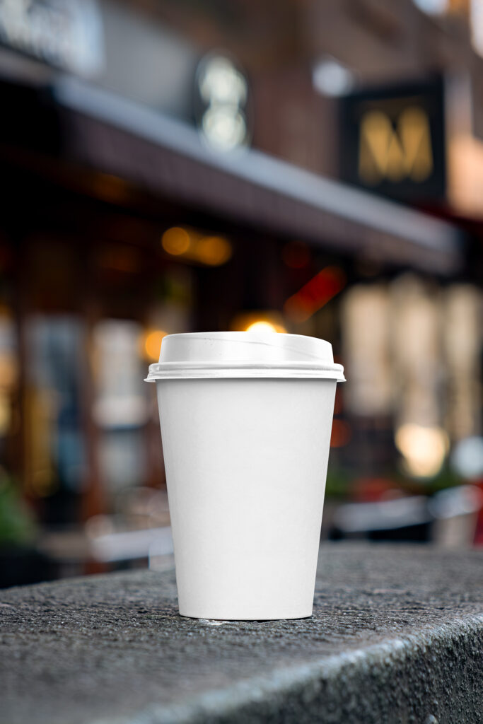 Free Paper Cup on Street Mockup - mockupbee